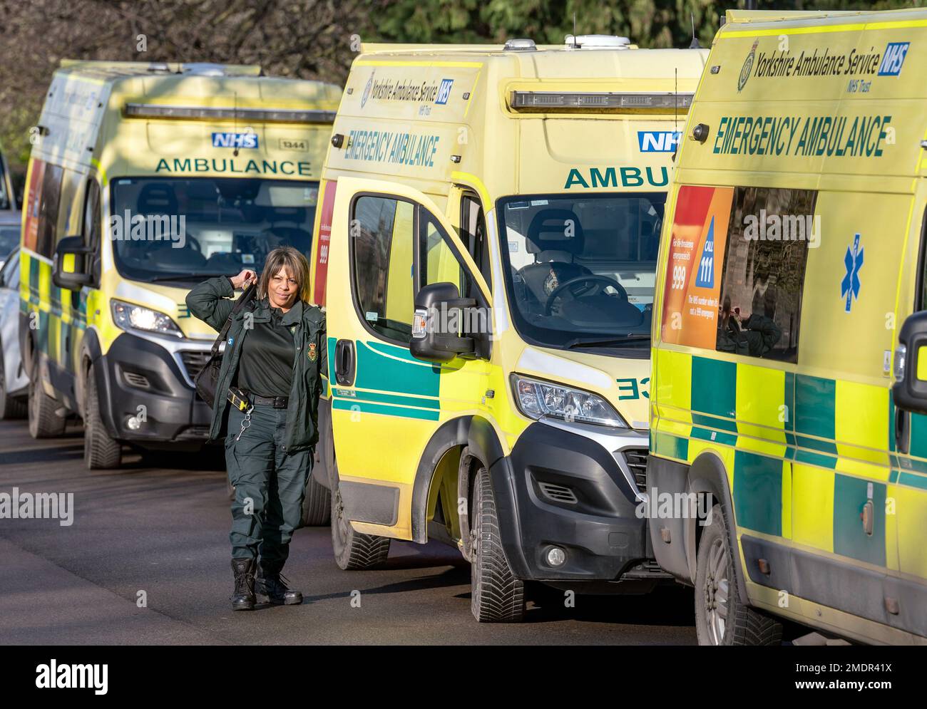 An ambulance worker returns from a call to the picket line outside ...