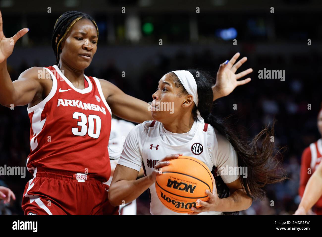 South Carolina guard Zia Cooke, right, drives into Arkansas forward ...