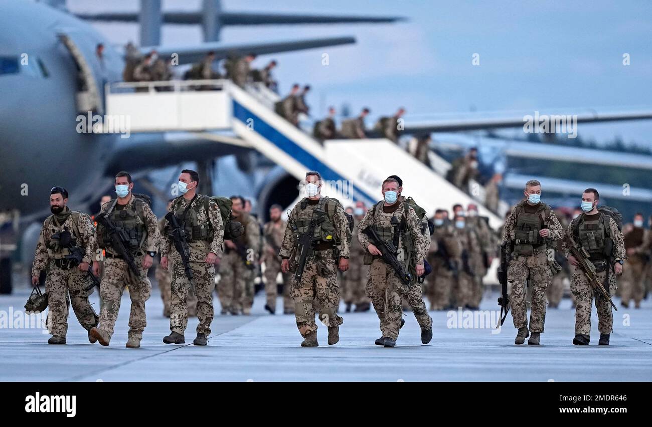 German Soldiers arrive on a plane from Tashkent, Uzbekistan at the ...