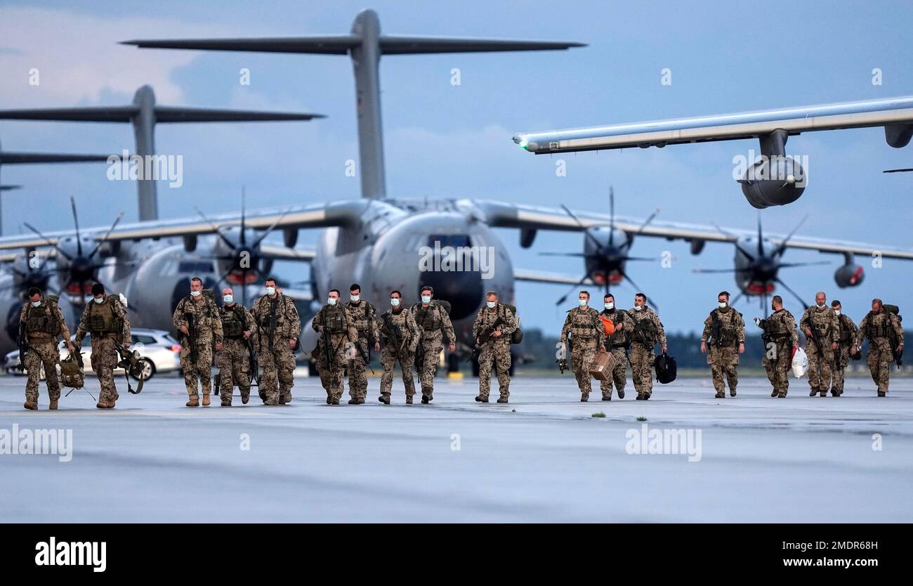 German Soldiers arrive on a plane from Tashkent, Uzbekistan at the ...