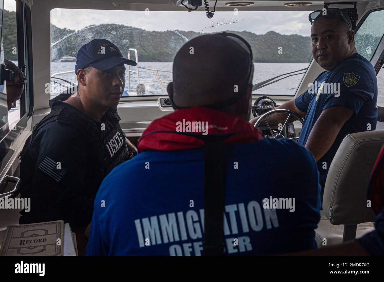U.S. Coast Guard Petty Officer 2nd Class Bruce Duarte, left, a maritime ...