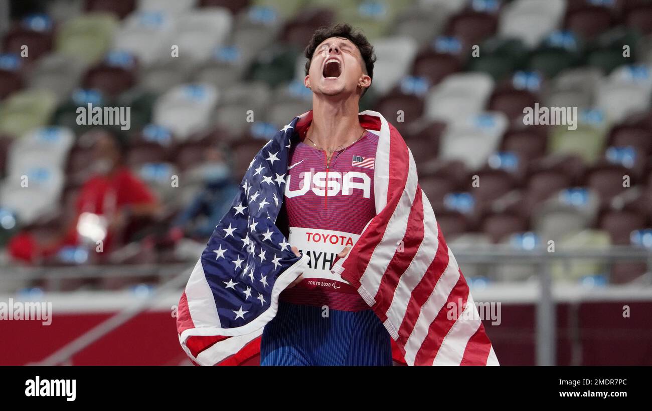 United States' Nick Mayhugh celebrates after winning the men's 100m T37 ...