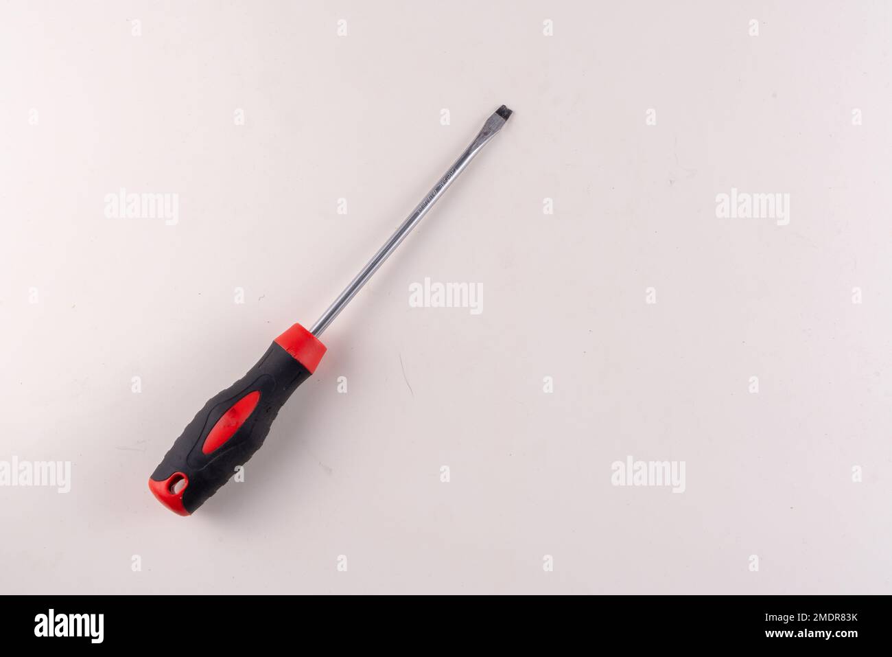 Top view of flat head screwdriver with rubber handle isolated on white ...