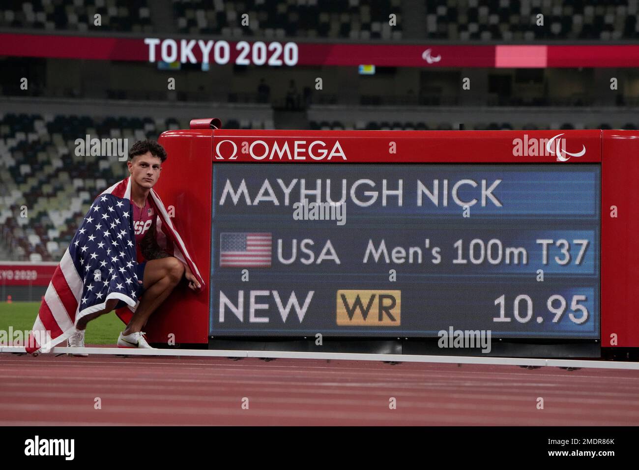 United States' Nick Mayhugh celebrates after winning the men's 100m T37 ...