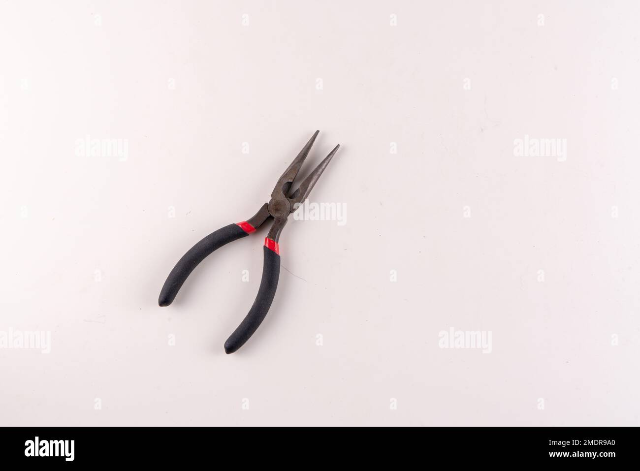 Top view of long nose pliers with side cutters on isolated white ...
