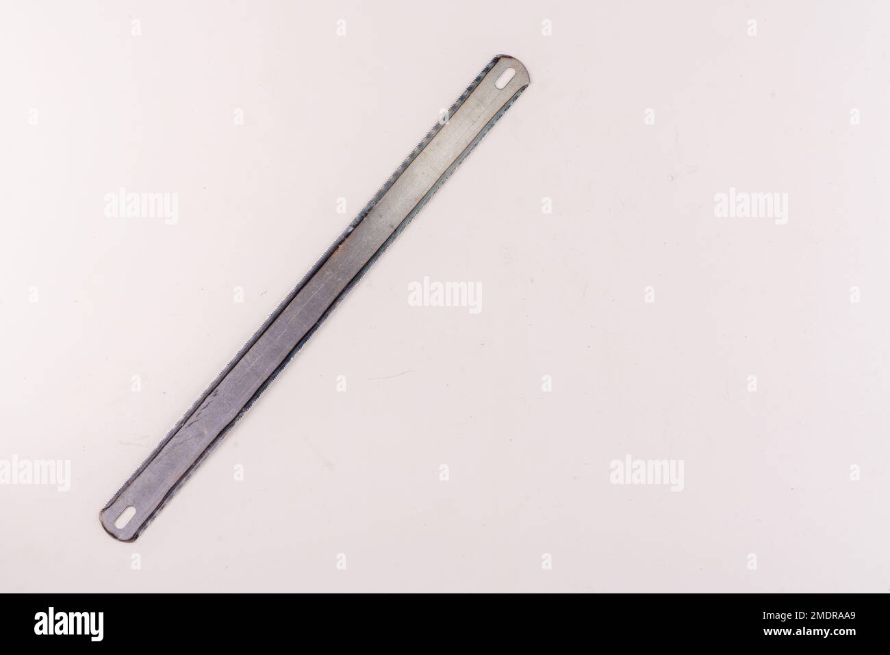 Top view of hacksaw blade isolated on white background with empty text ...