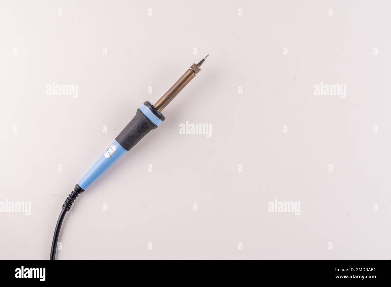 Selective focus top view of soldering iron isolated on white background ...