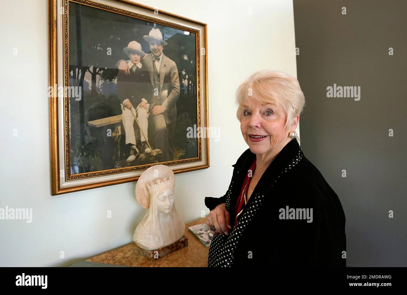 Diane Capone discusses her family near a photograph of her father ...