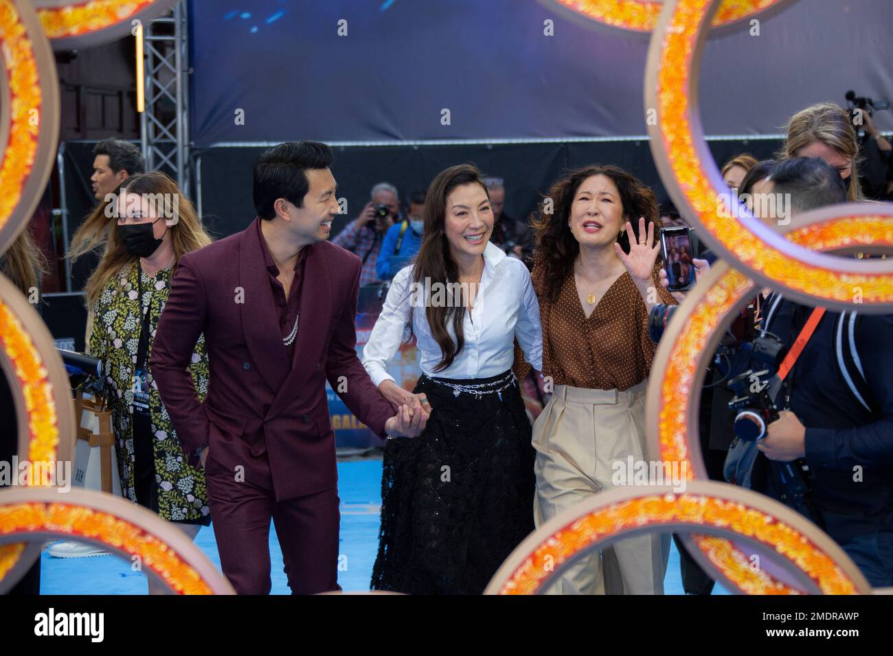Actors Simu Liu, Michelle Yeoh and Sandra Oh pose for photographs on ...