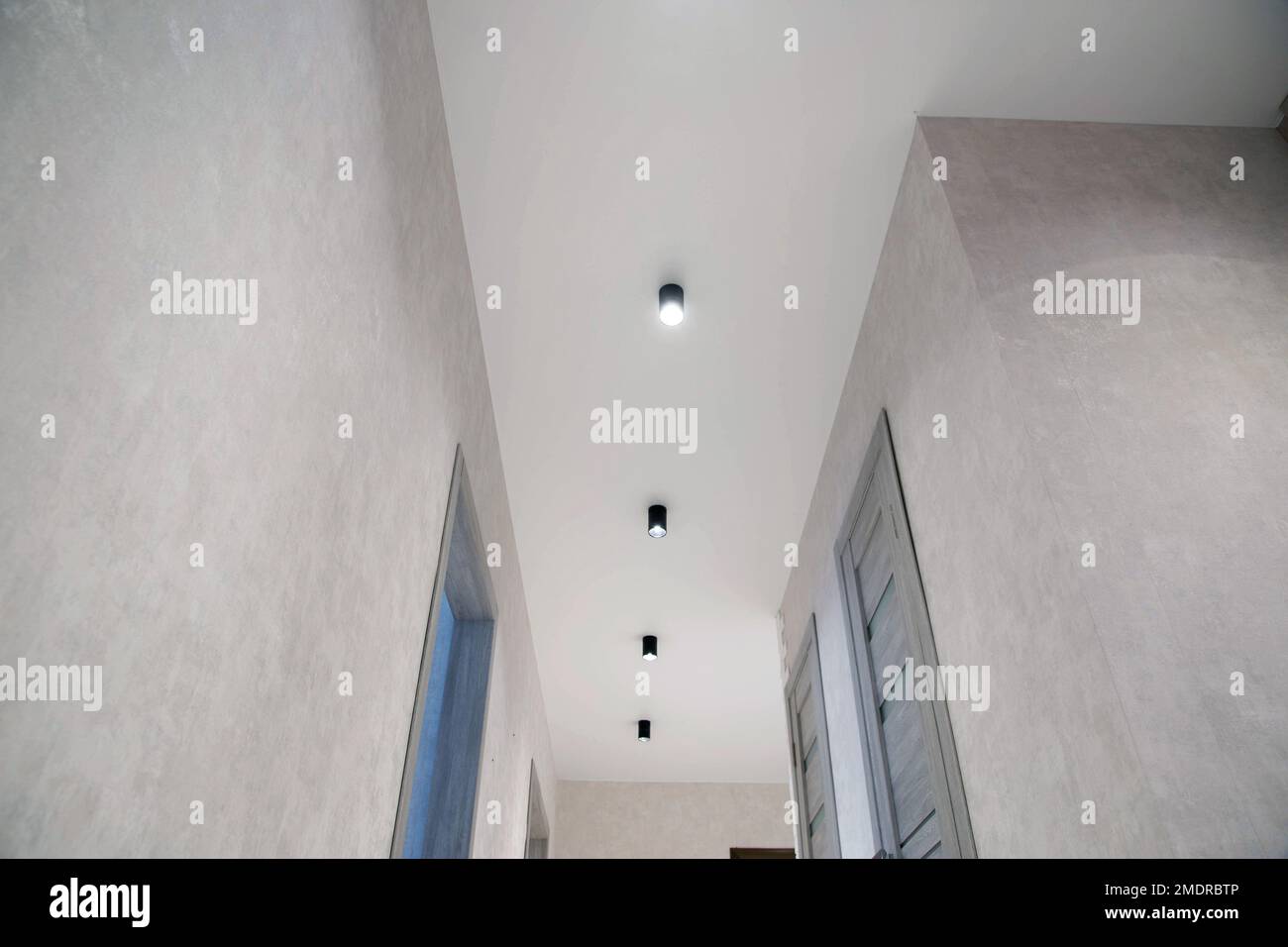 Beautiful black LED lights on the ceiling. Modern stretch ceiling ...
