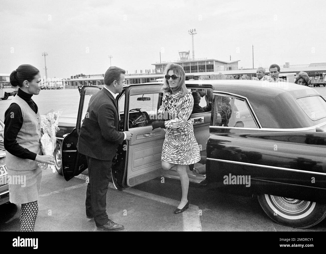 Princess Lee Radziwill steps out of a limousine at Athens Airport for ...