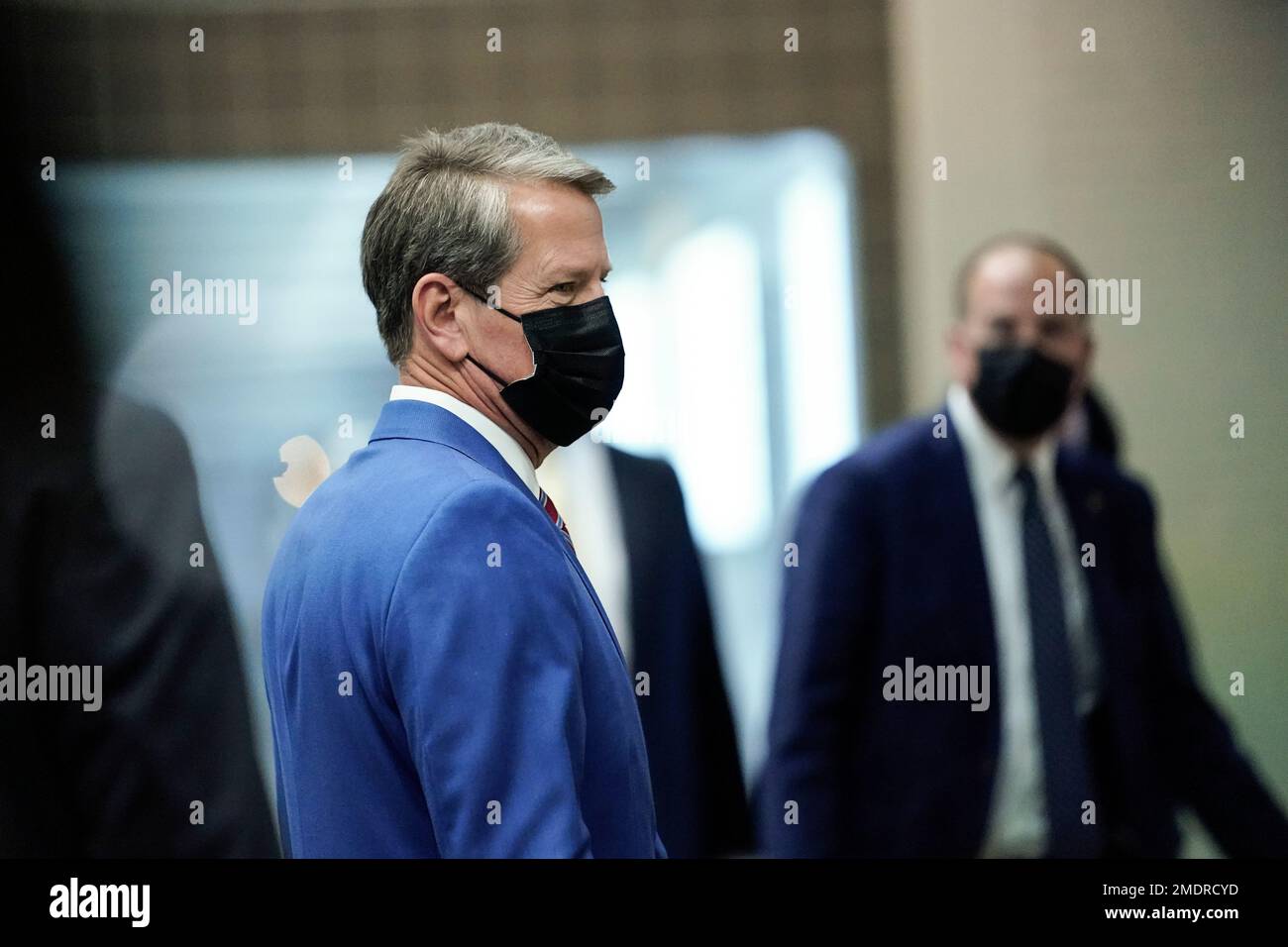 Georgia Gov. Brian Kemp leaves after speaking during a news conference ...