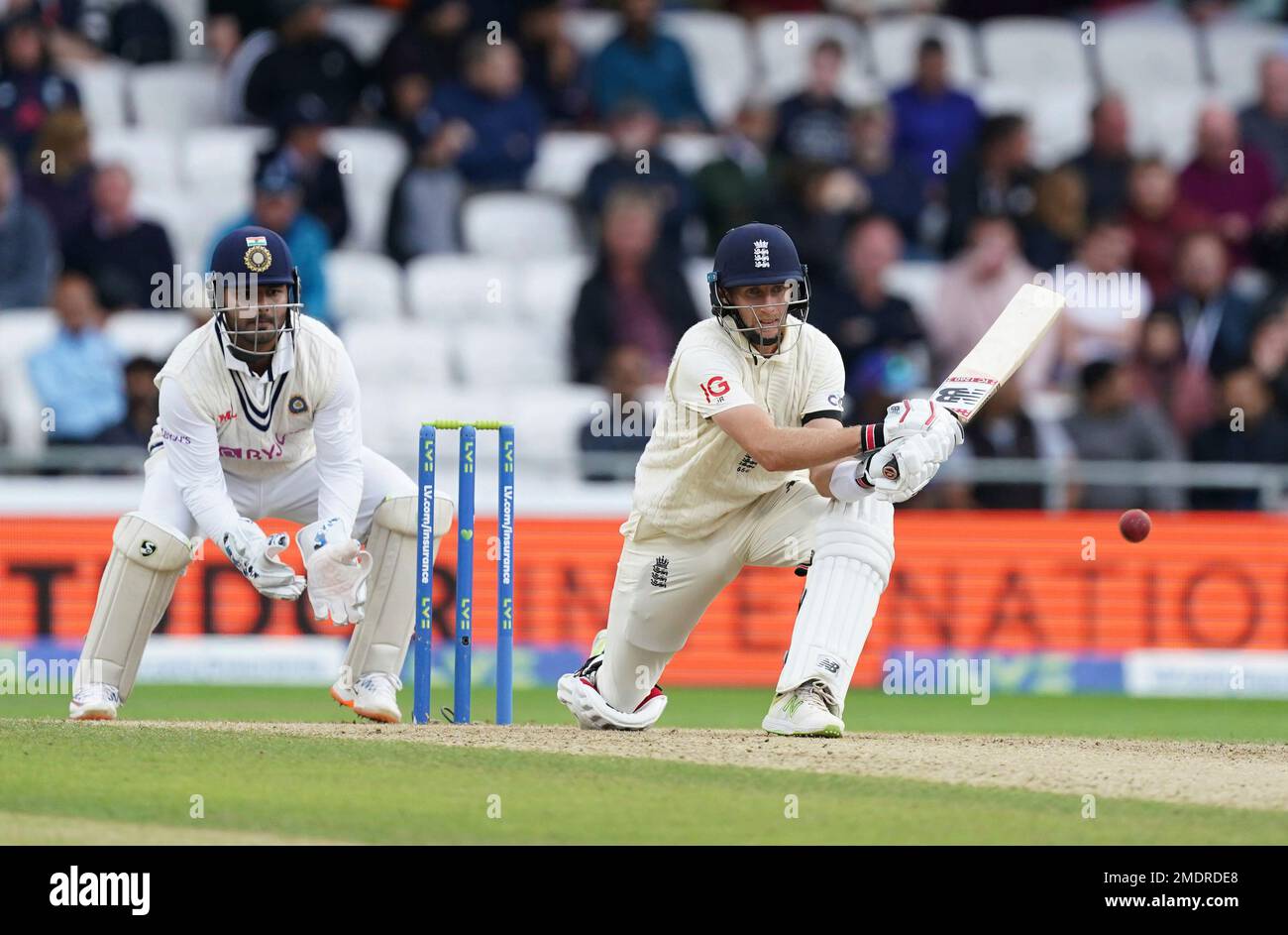 England captain Joe Root, right, plays a reverse sweep during the ...