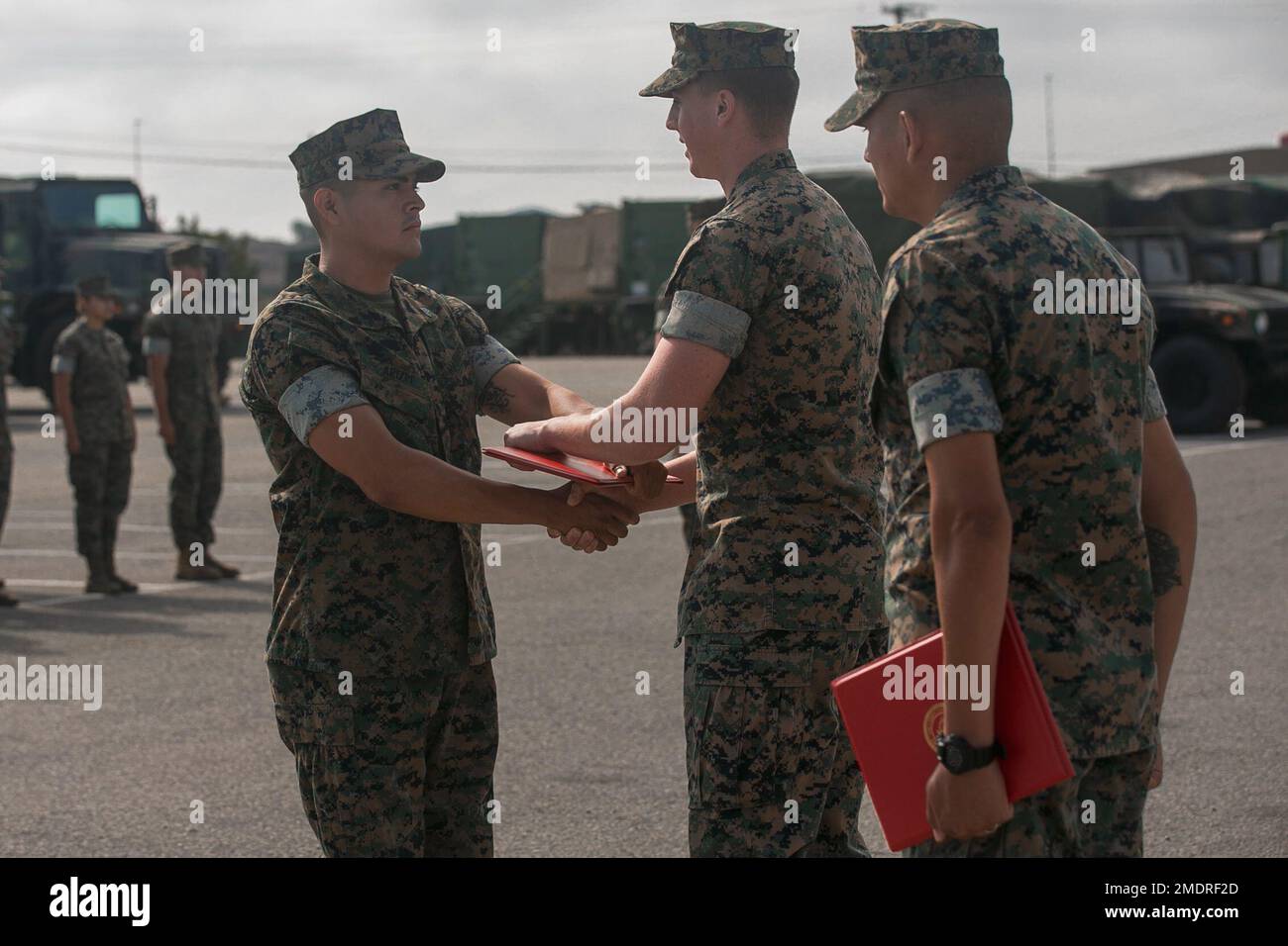 U.S. Marine Corps Sgt. Joe Arizpe, left, a motor transportation ...