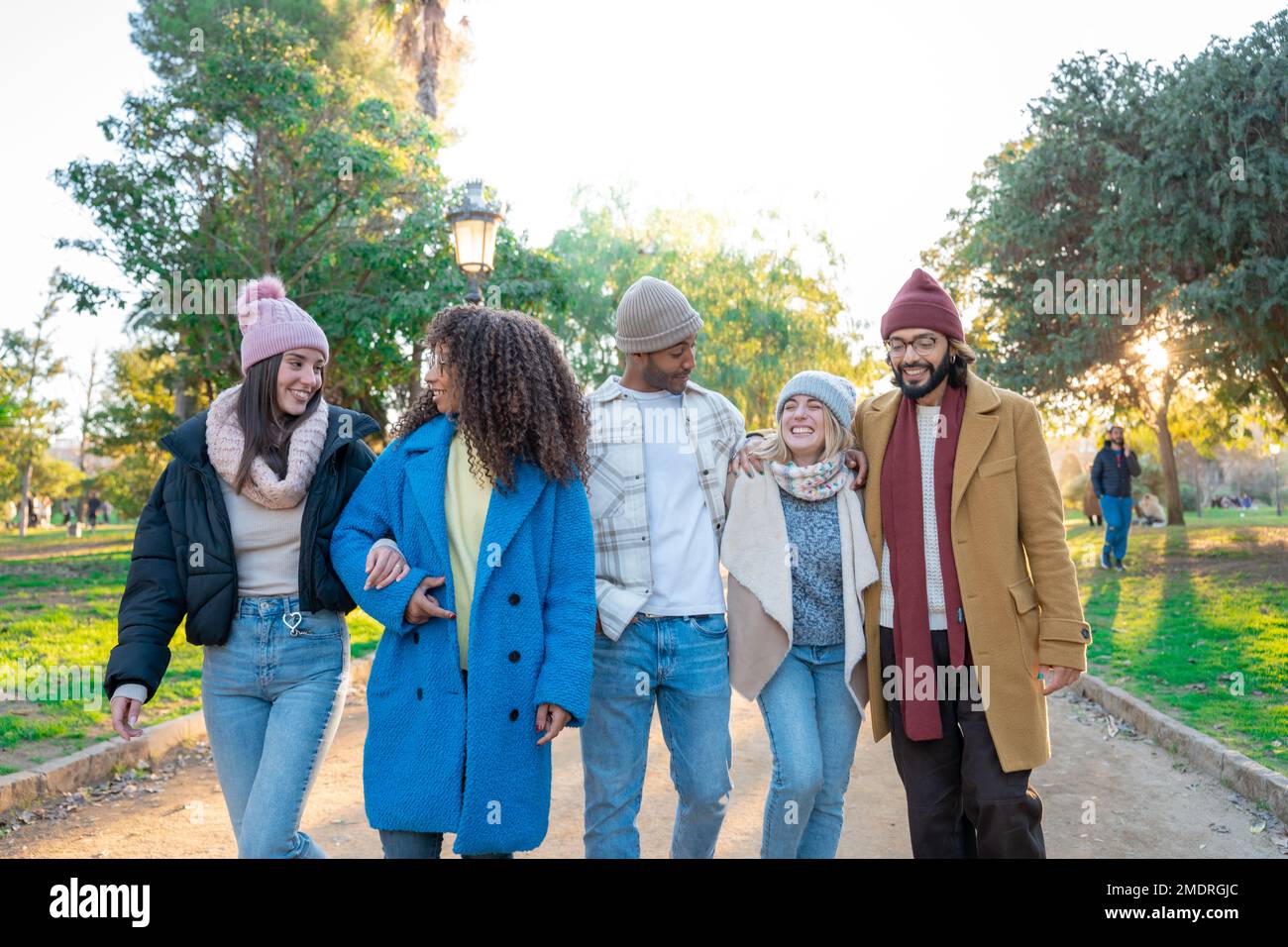 Cheerful group of students walking outdoors in the campus University ...