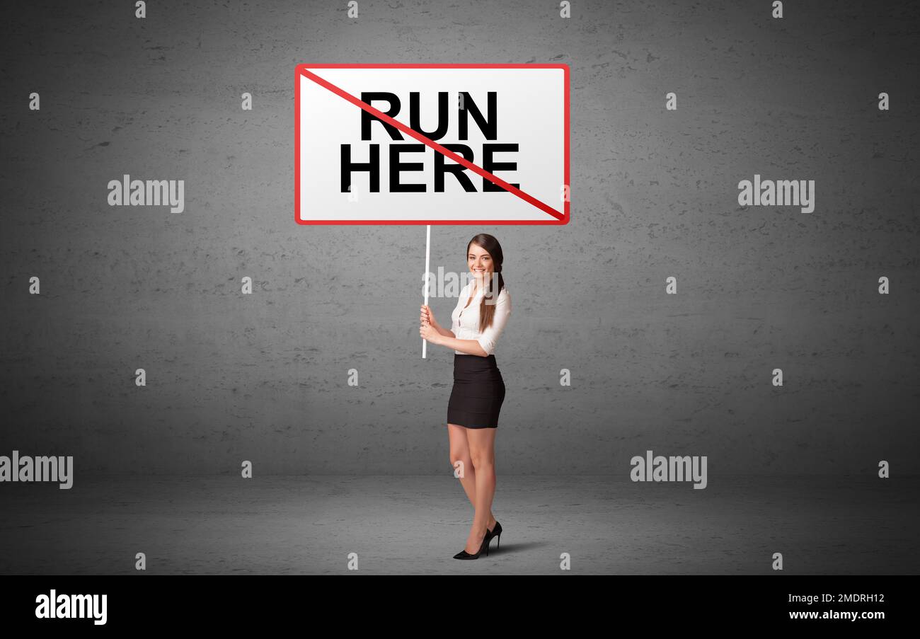 business person holding a traffic sign Stock Photo - Alamy