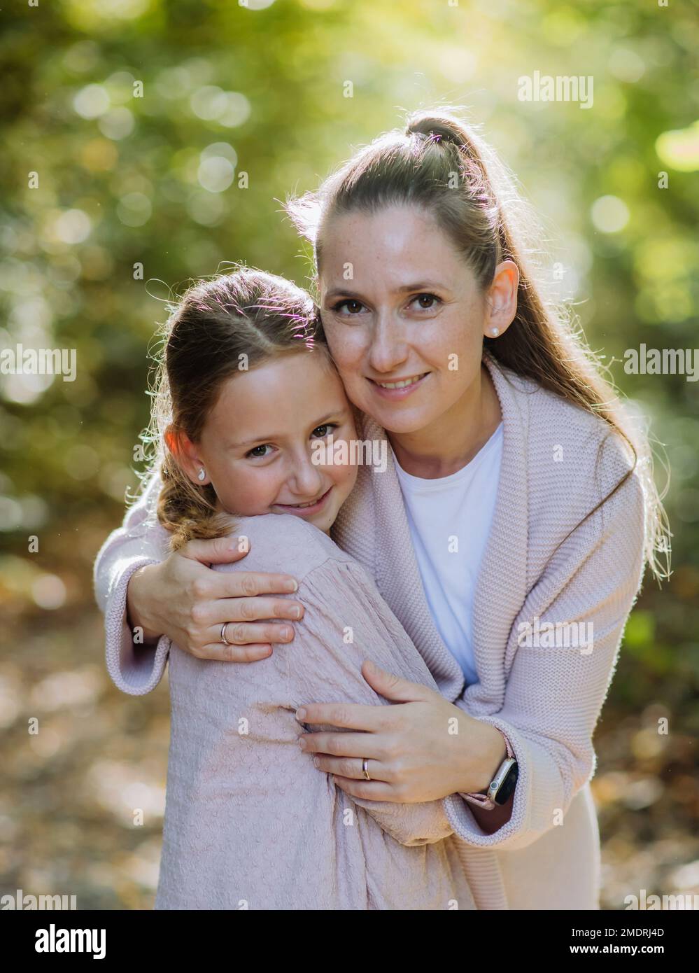 Portrait of mother with her daughter in forest Stock Photo - Alamy