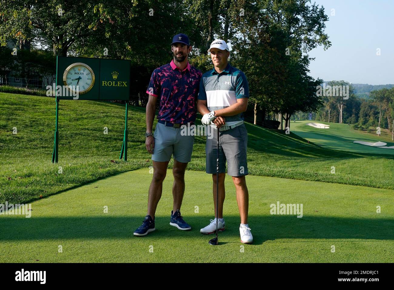 Michael Phelps, left, and Jordan Spieth pose for photographs before participating in the ProAm ...