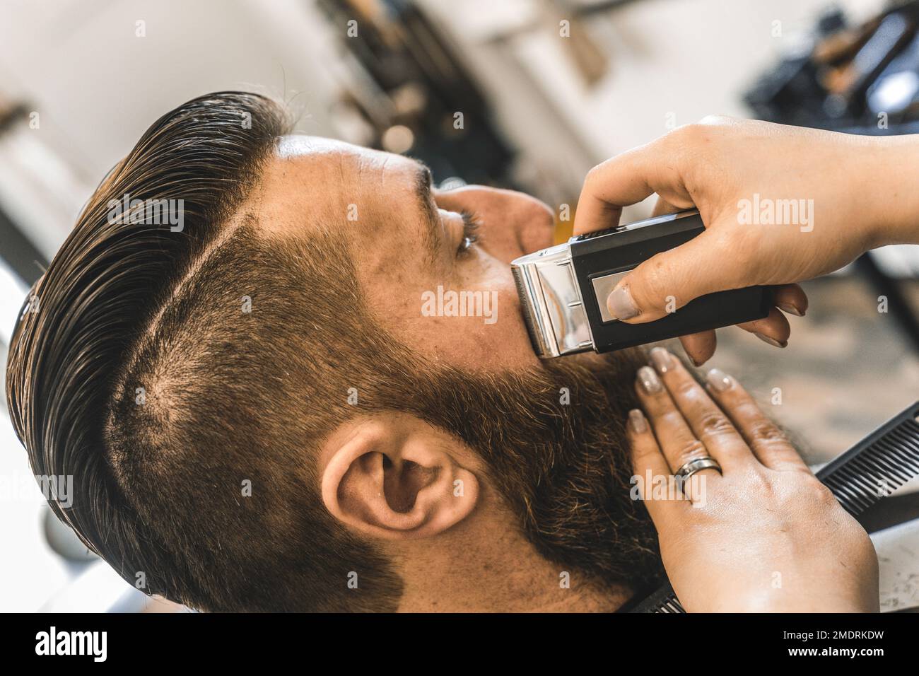 Hipster Man At Barbershop Salon Getting Beard And Hair Cut