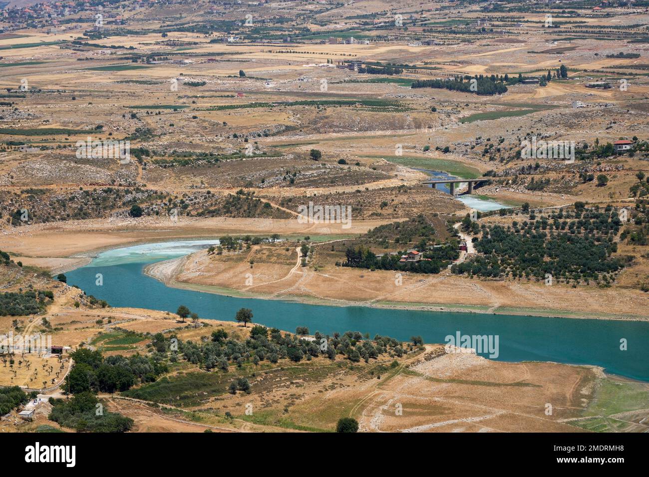 Heavily polluted Litani River flows through the village of Saghbin ...