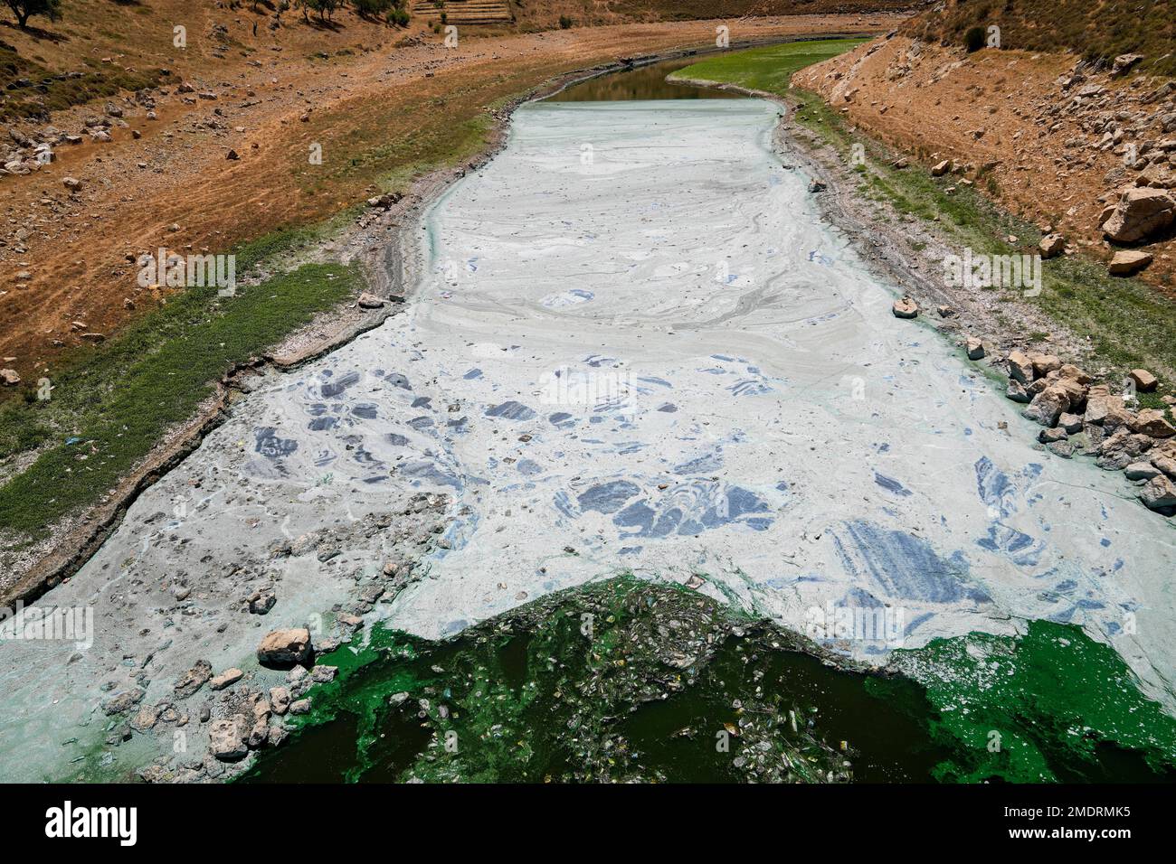 Trash piles up in the heavily polluted Litani River as it flows through ...