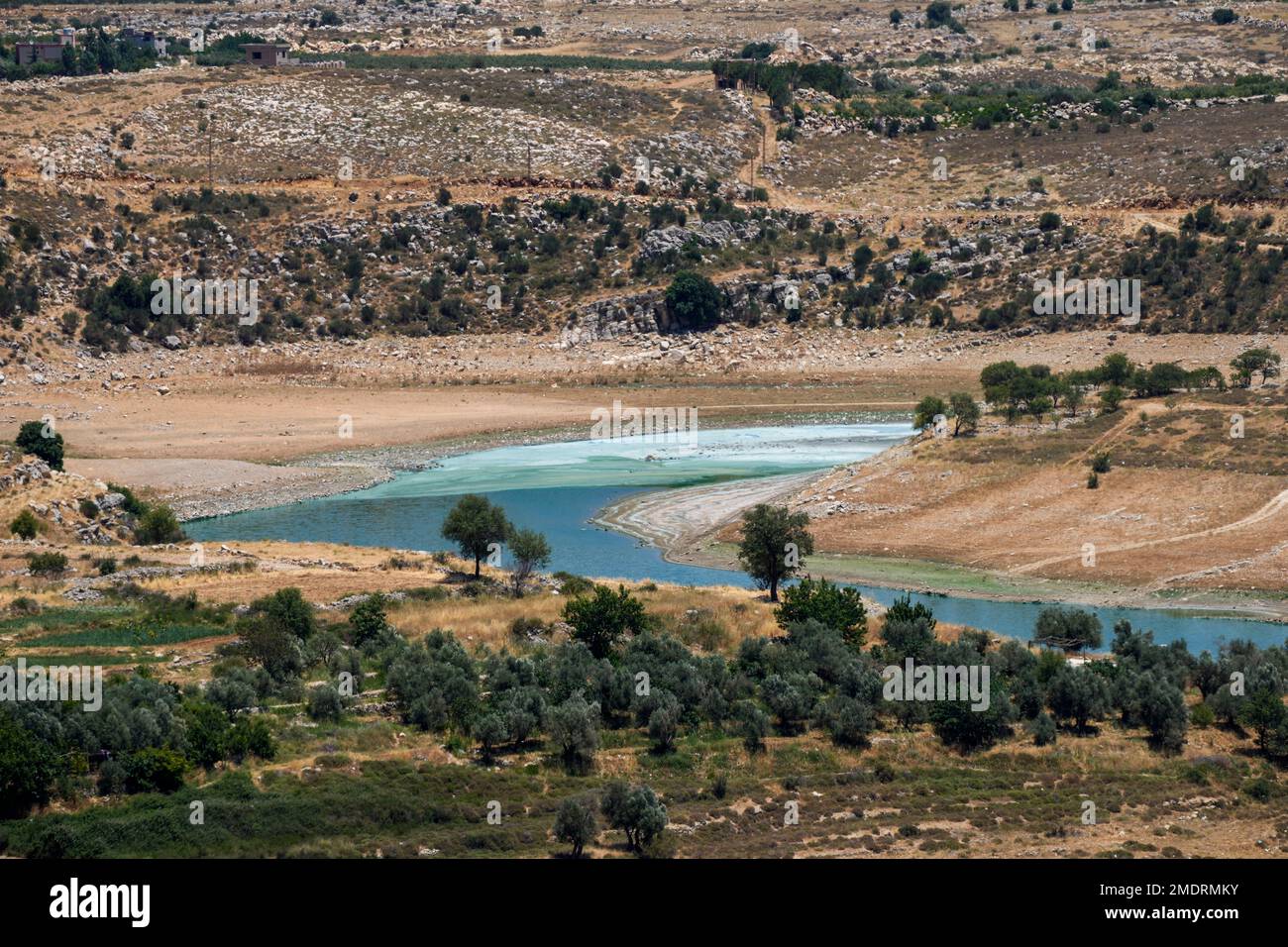 Heavily polluted Litani River flows through the village of Saghbin ...
