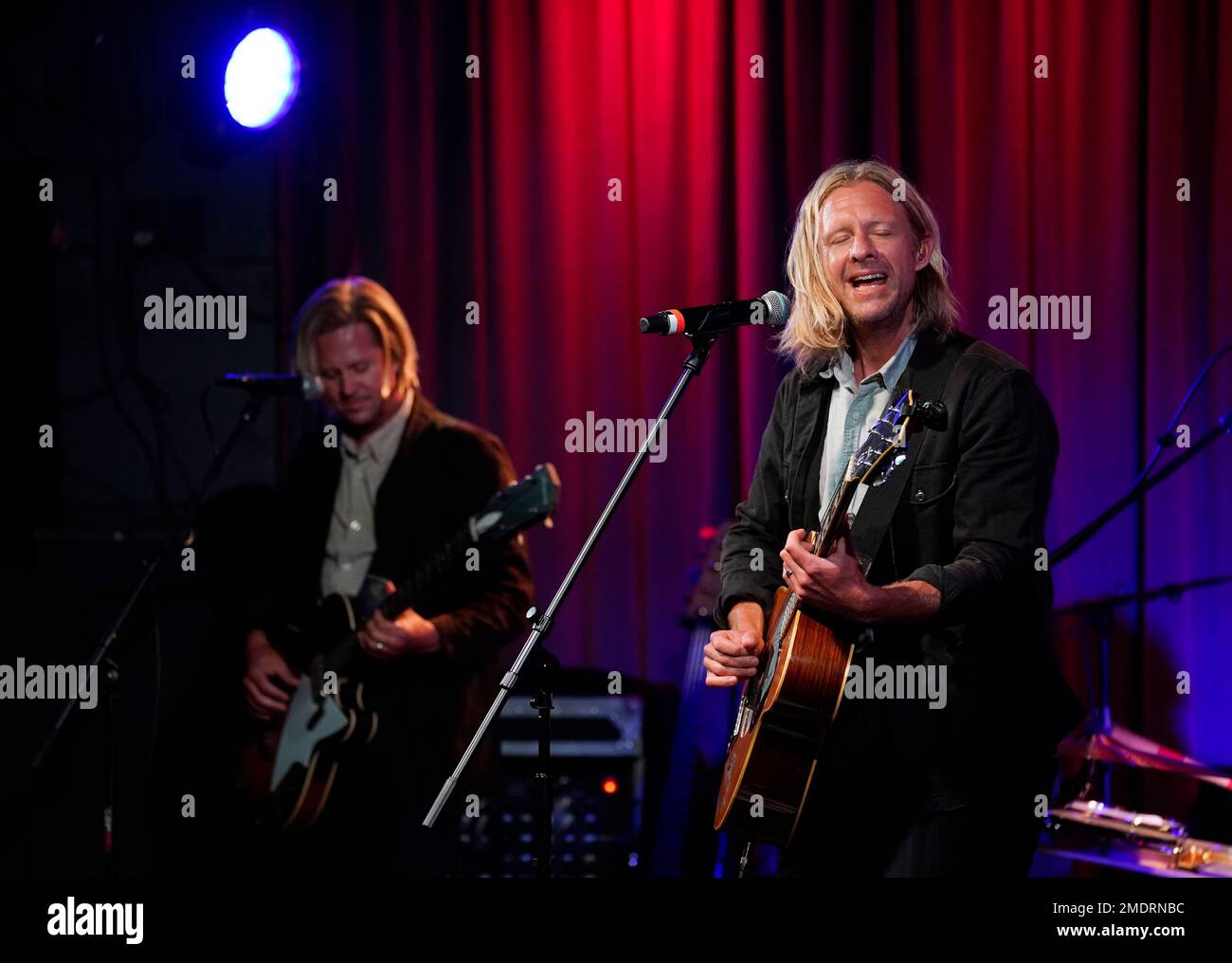 Jon Foreman, right, and his brother Tim of the band Switchfoot perform ...