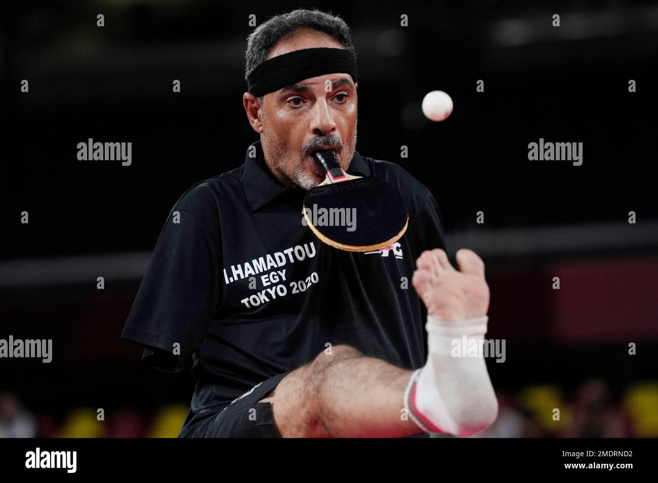 Ibrahim Hamadtou of Egypt flicks the ball with his toes to serves ...