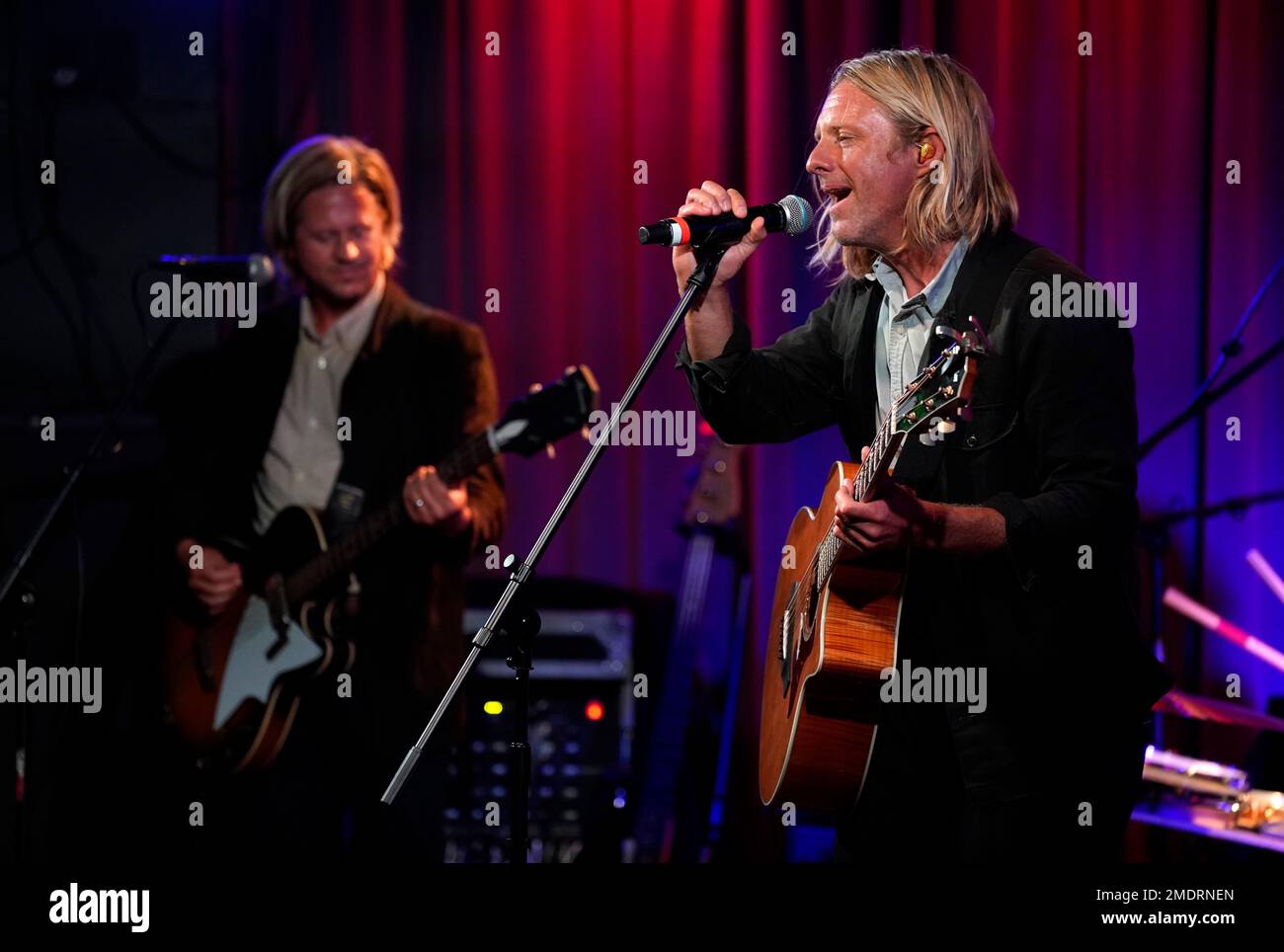 Jon Foreman, right, and his brother Tim of the band Switchfoot performs ...