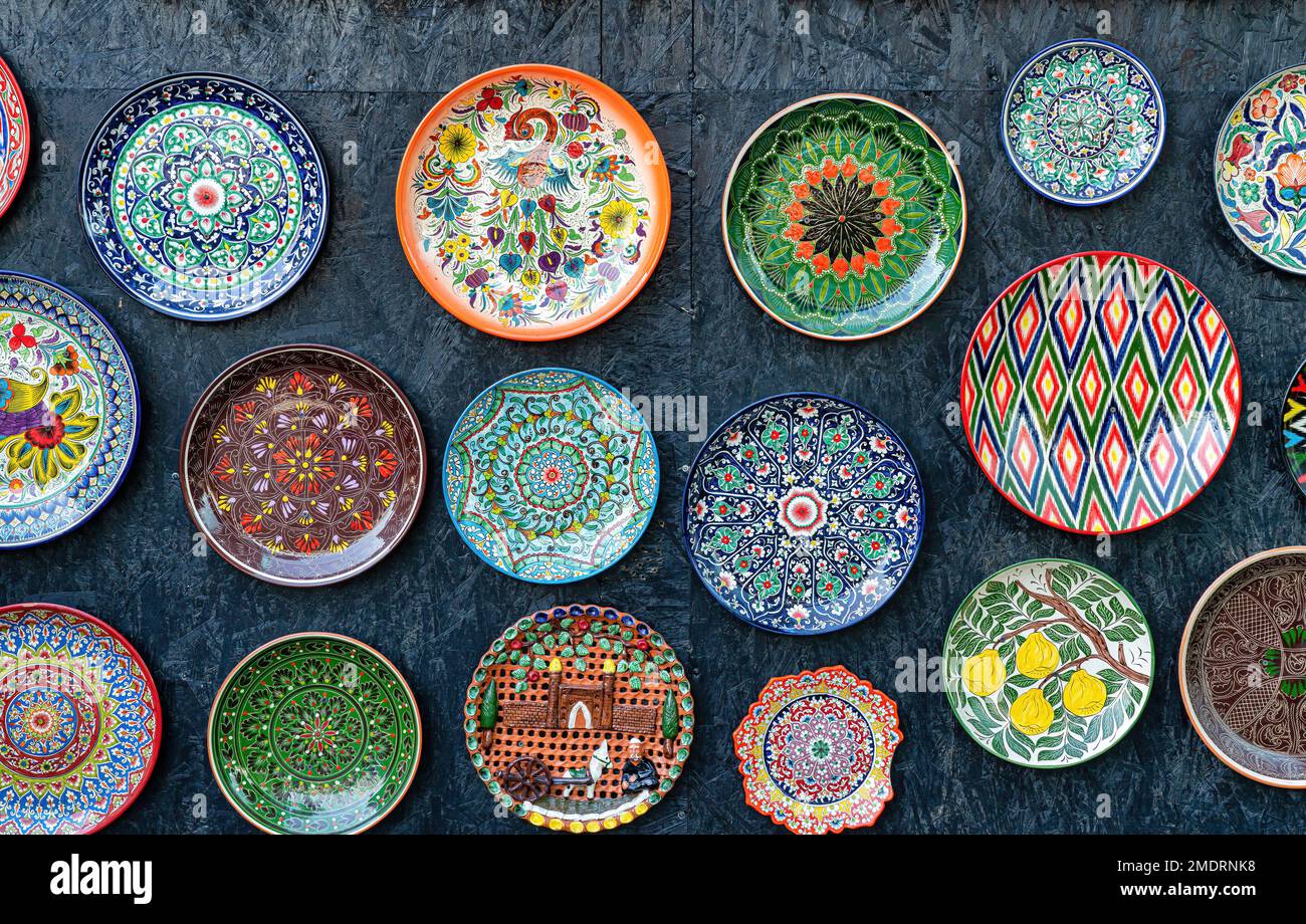 Arabic painted ceramic plates hanging on the wall Stock Photo - Alamy