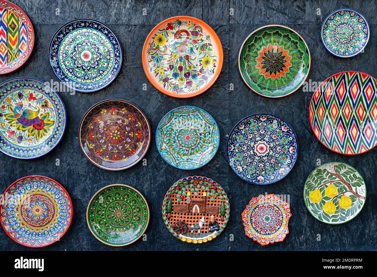 Arabic painted ceramic plates hanging on the wall Stock Photo - Alamy
