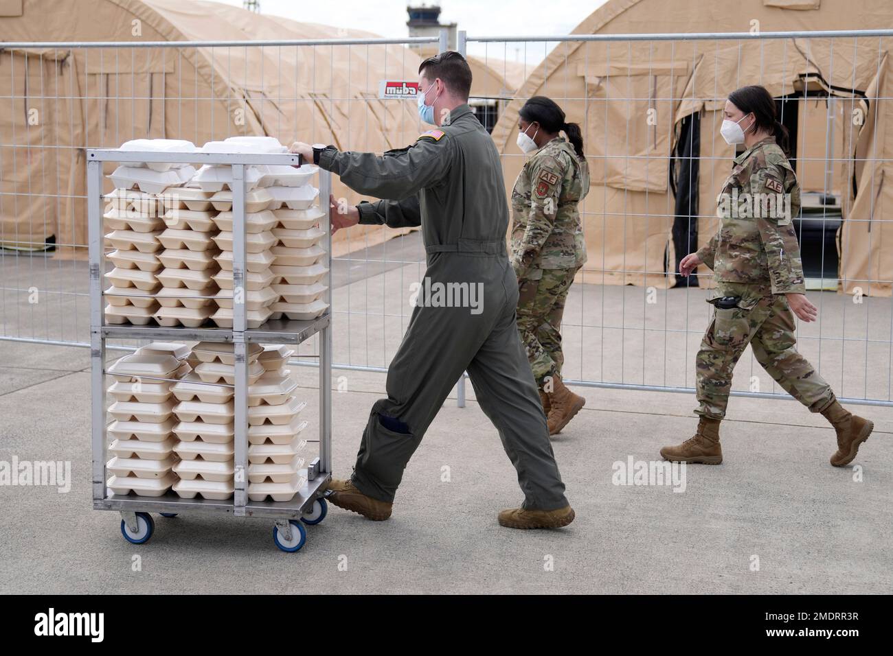 A U.S. soldier transports food for recently evacuated Afghan people at ...