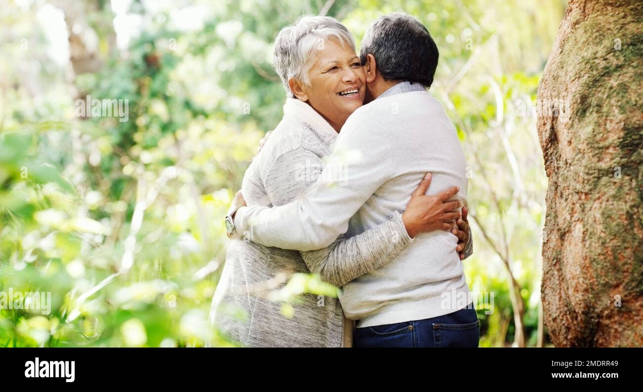 In each others arms is where we belong. an affectionate senior couple ...