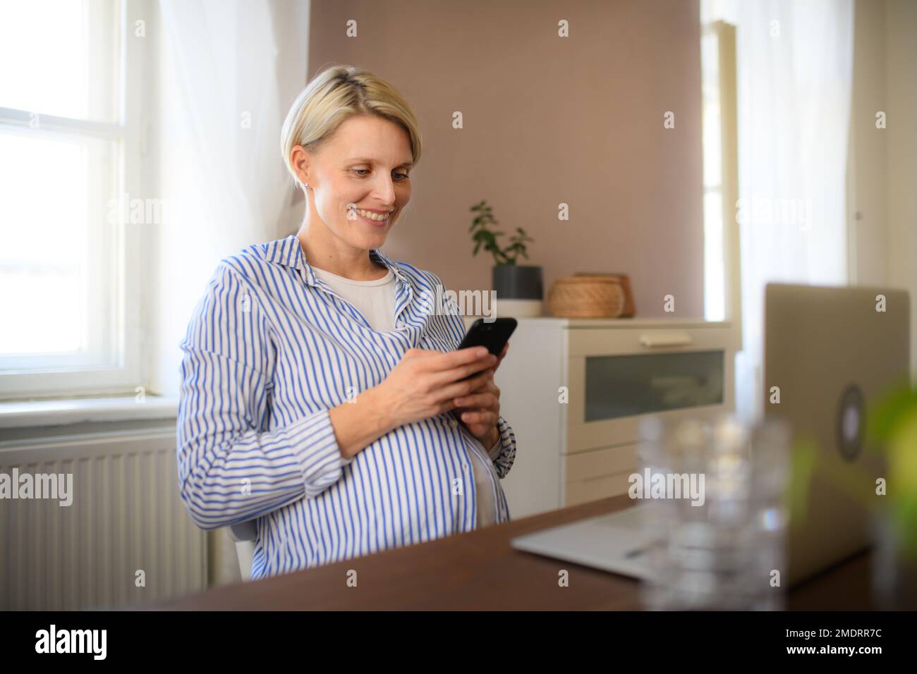 Woman scrolling phone hi-res stock photography and images - Alamy