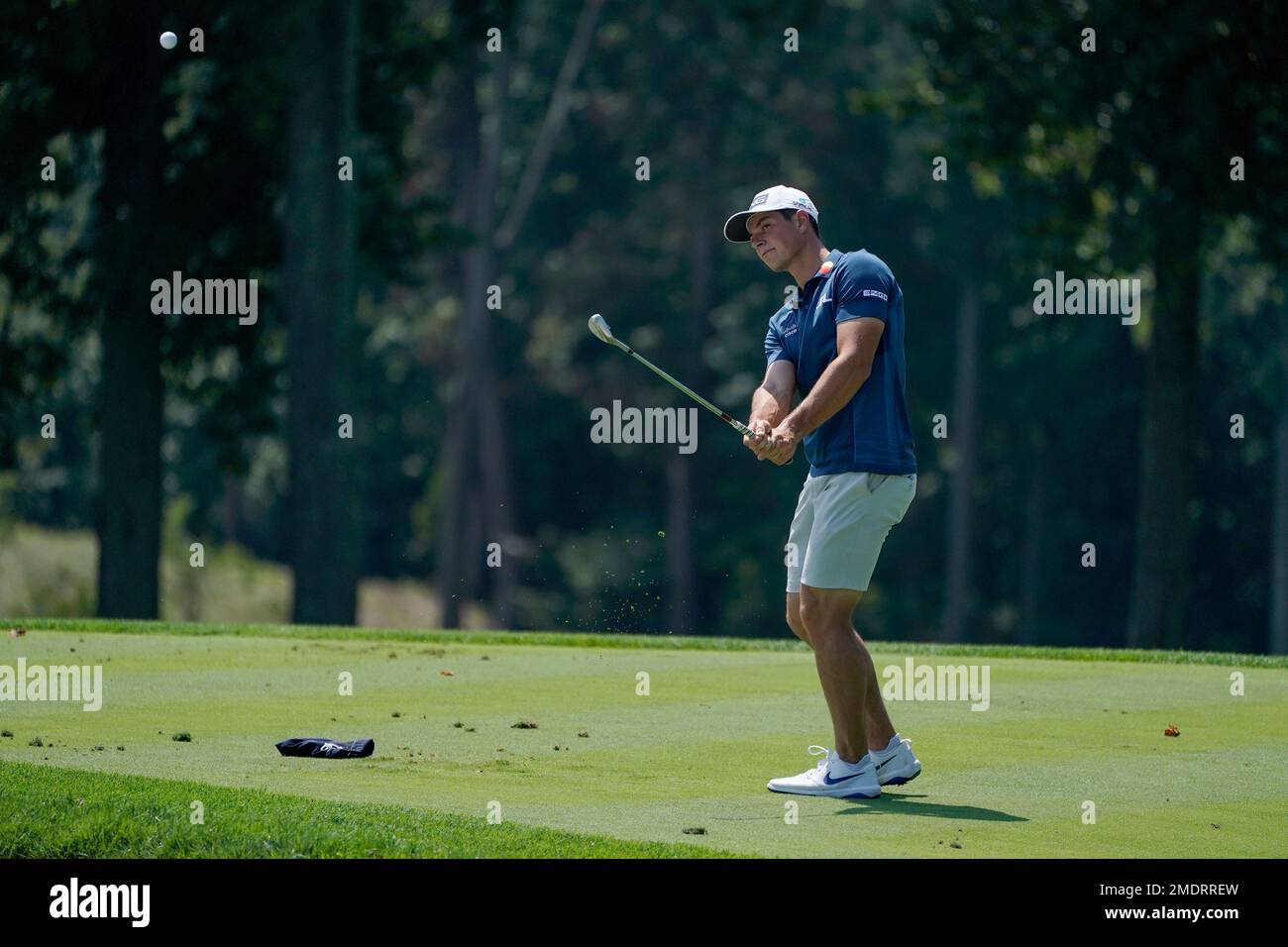 Viktor Hovland, of Norway, chips while working out ahead of the BMW Championship golf tournament ...