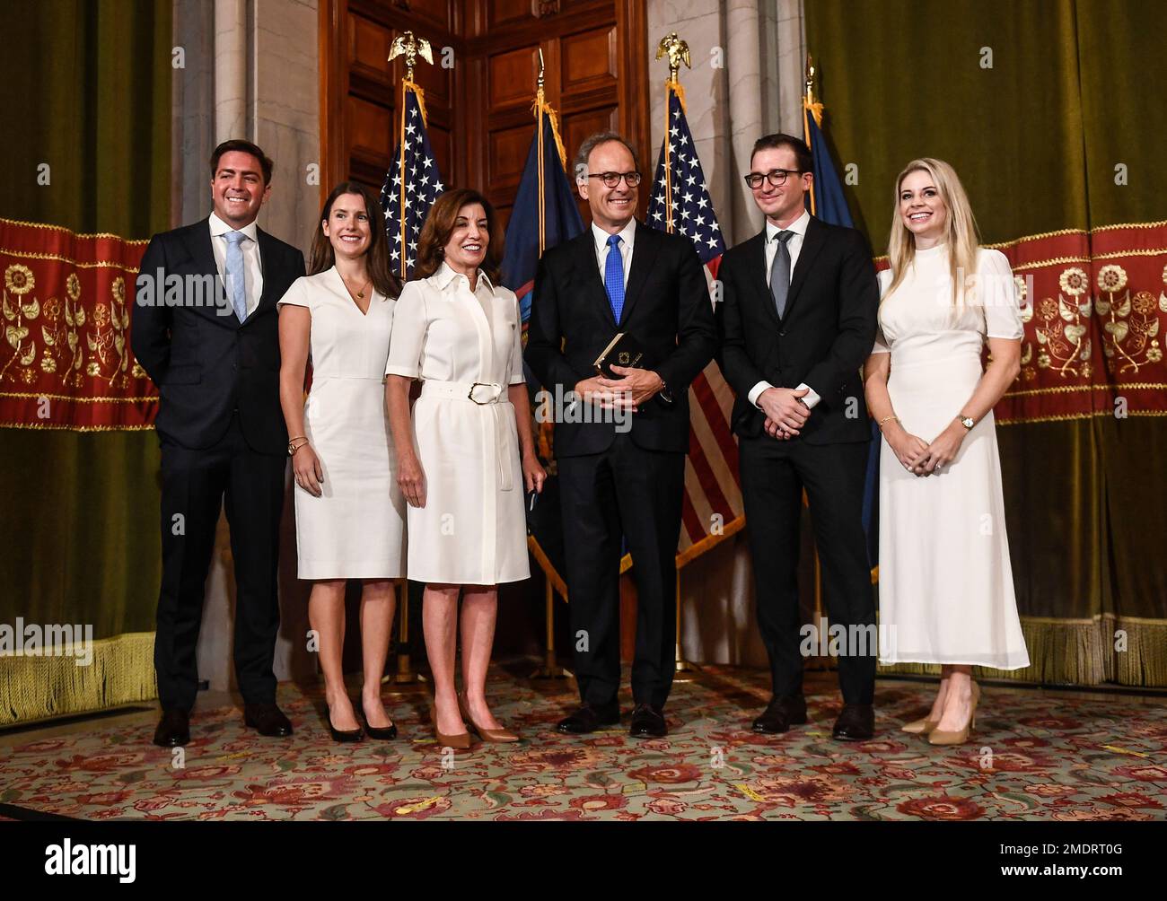 New York Gov. Kathy Hochul, third from left, stands with her husband ...