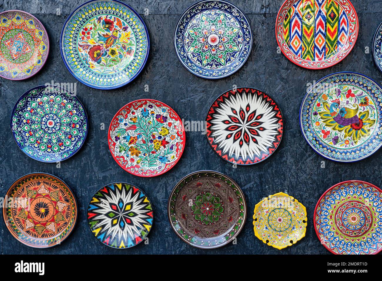 Arabic painted ceramic plates hanging on the wall Stock Photo - Alamy