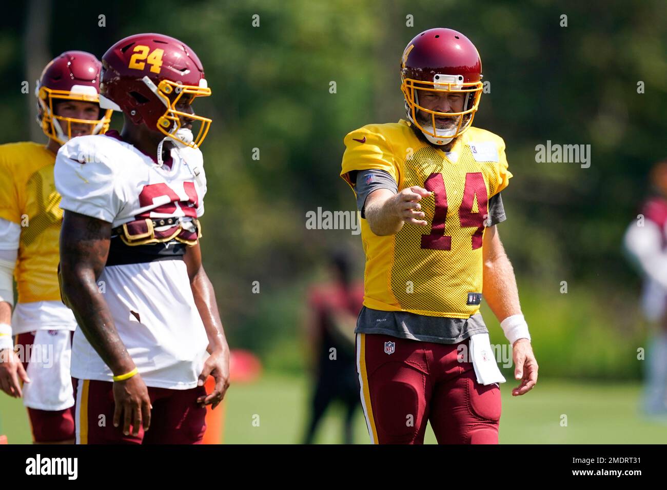 Washington Football Team quarterback Ryan Fitzpatrick (14) directs ...