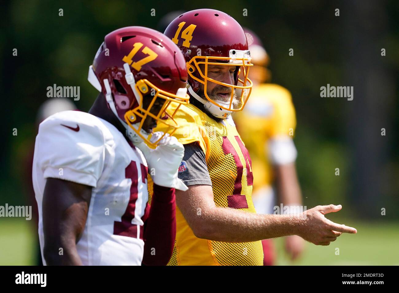 Washington Football Team quarterback Ryan Fitzpatrick (14) directs wide ...