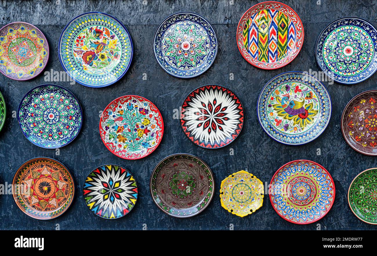 Arabic painted ceramic plates hanging on the wall Stock Photo - Alamy