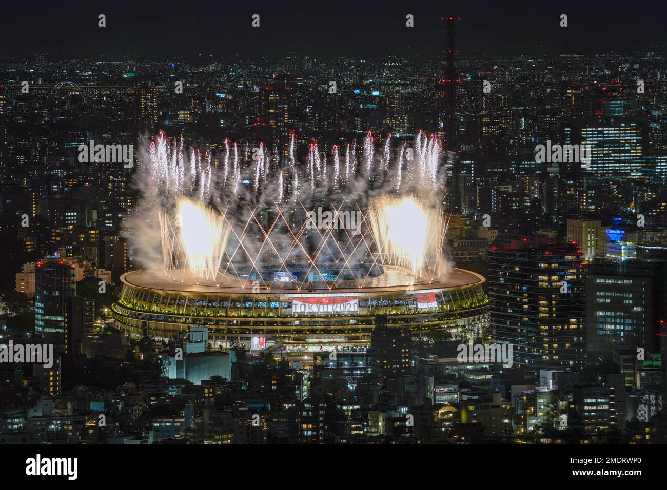 Fireworks illuminate over National Stadium viewed from Shibuya Sky ...