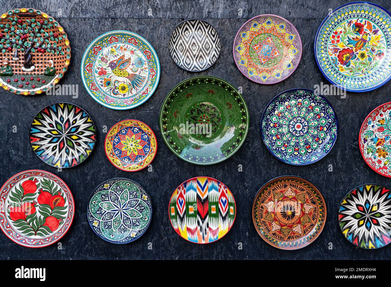 Arabic painted ceramic plates hanging on the wall Stock Photo - Alamy