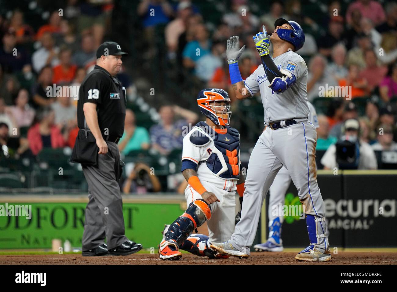 Kansas City Royals' Salvador Perez, right, celebrates after hitting a ...