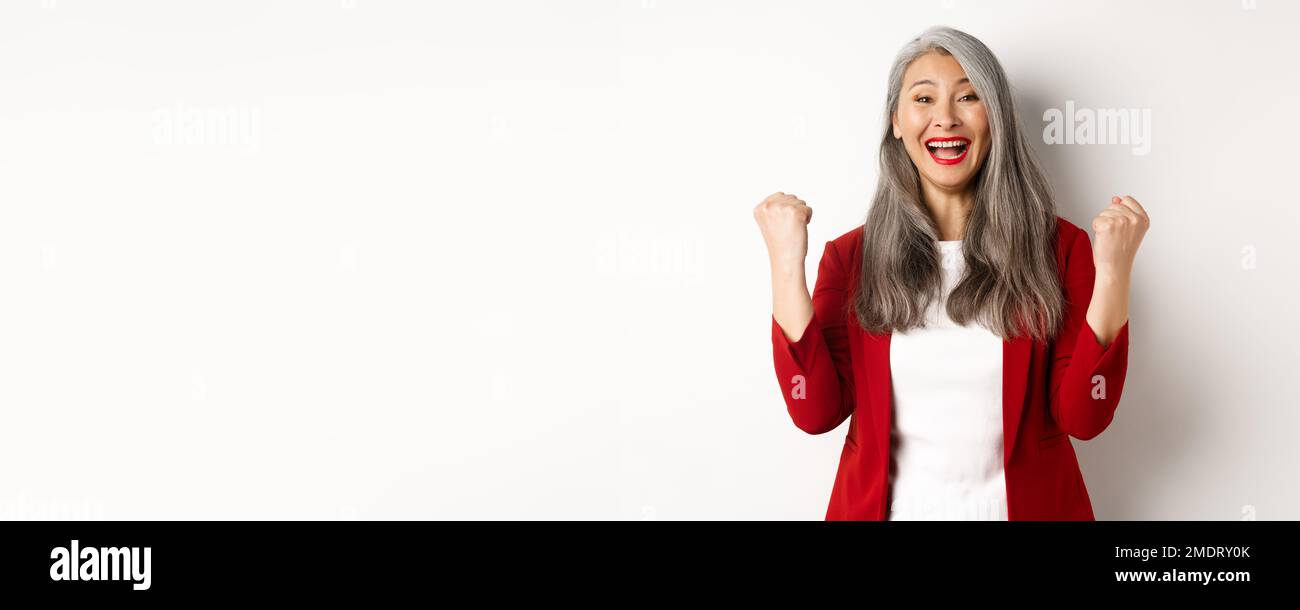 Lucky asian businesswoman achieve success, winning prize and ...
