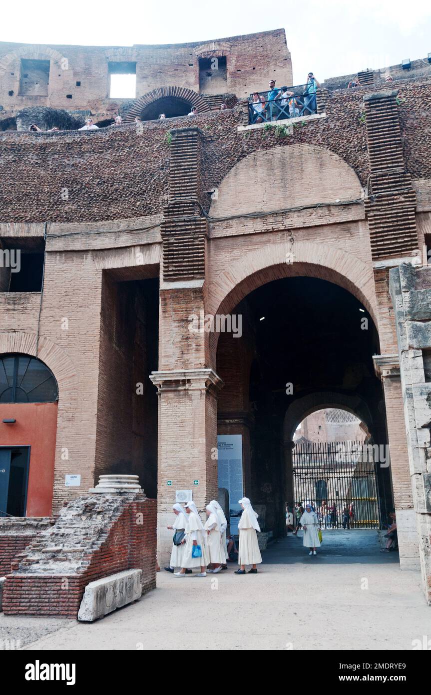 Nuns walking inside the Colosseum, Rome, Italy Stock Photo - Alamy