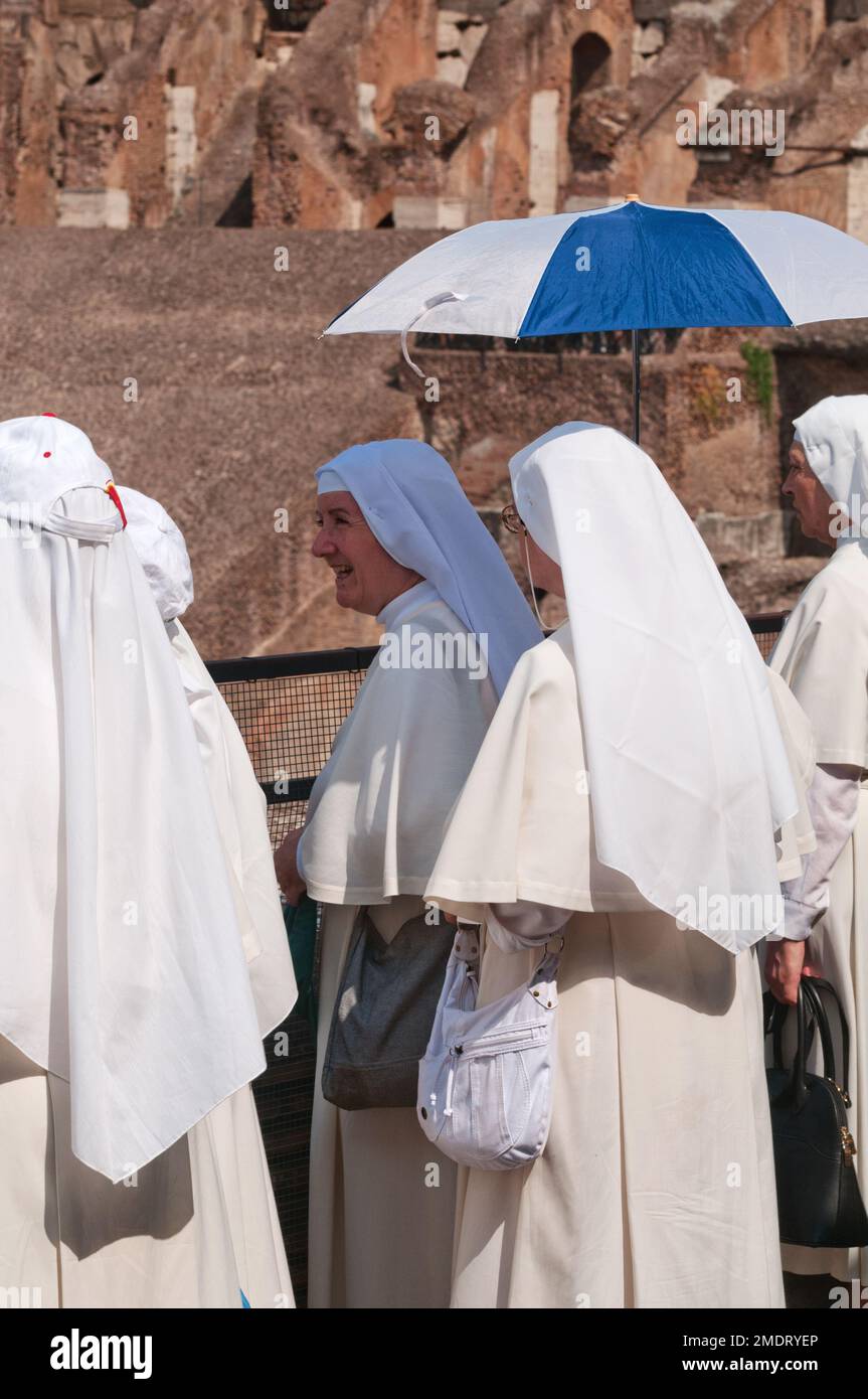 Nuns walking inside the Colosseum, Rome, Italy Stock Photo - Alamy