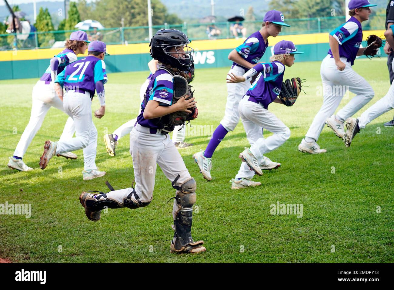 Abilene, Texas, catcher Ella Bruning, foreground, takes the field ...