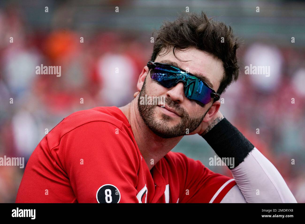 Cincinnati Reds right fielder Tyler Naquin (12) stands in the dugout ...