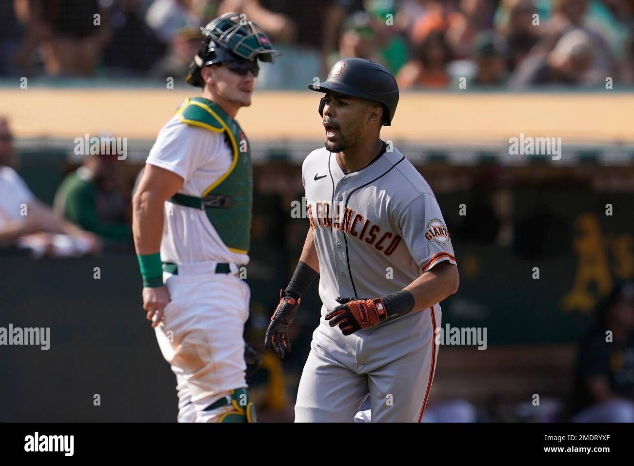 San Francisco Giants' LaMonte Wade Jr., right, reacts after hitting a ...
