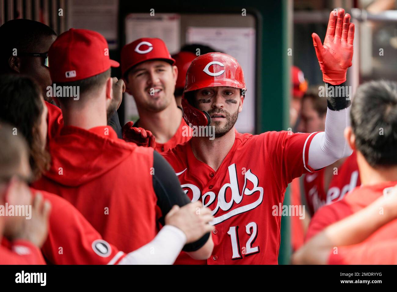 Cincinnati Reds' Tyler Naquin (12) celebrates with teammates after ...